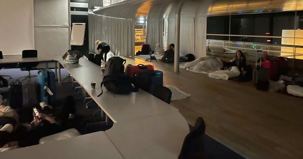 Passengers sleep overnight on FLOOR in airport after…