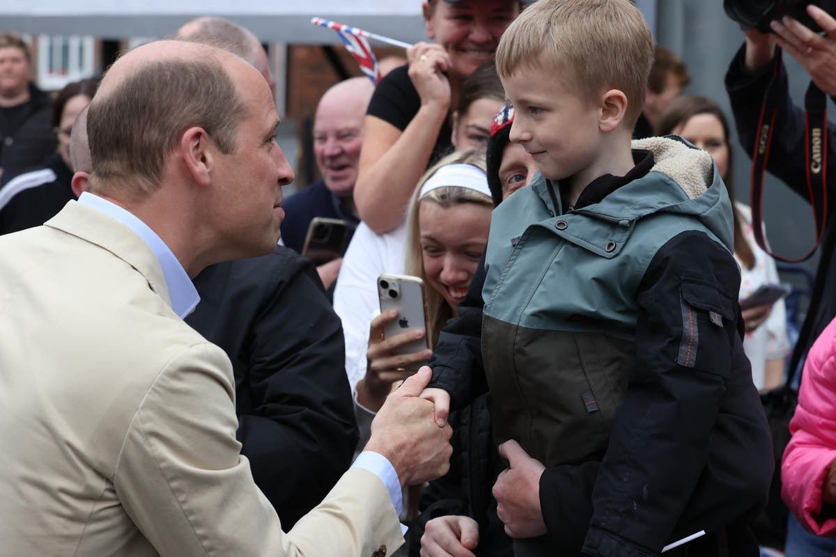 William jokes he’ll get into trouble as he hugs…