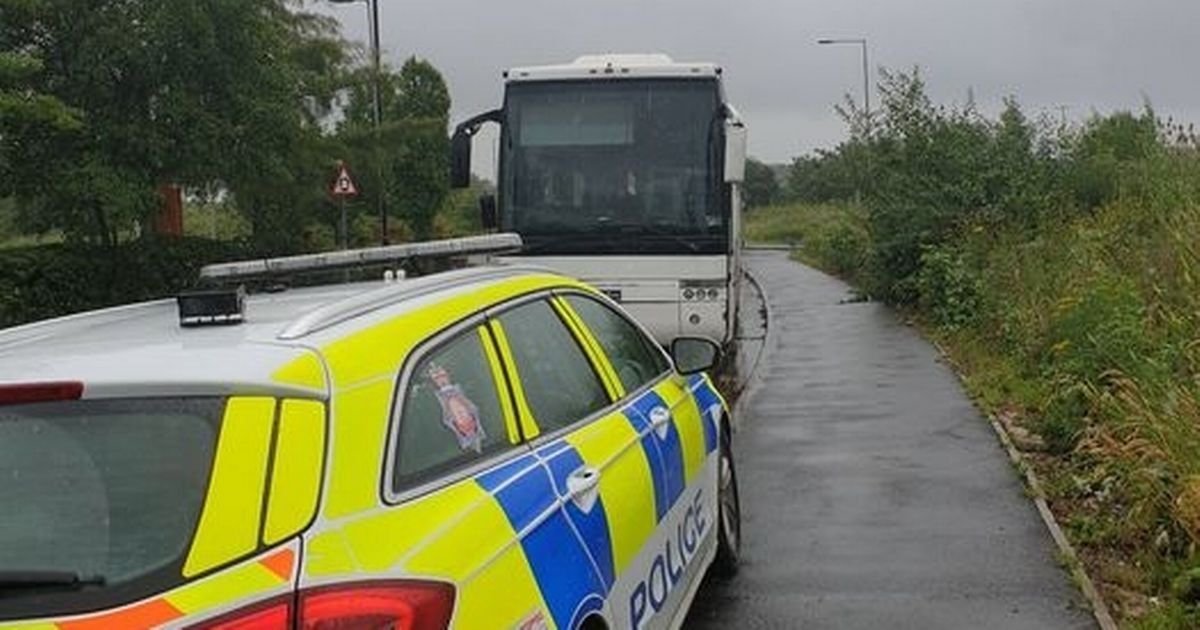 Police stop bus with school children on board and…