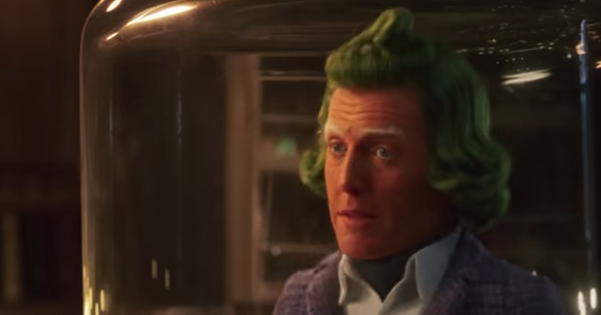 Hugh Grant unveiled as green-haired Oompa Loompa as…