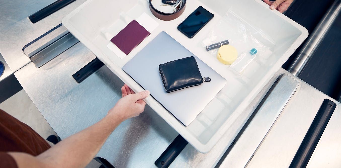 Why do I have to take my laptop out of the bag at…