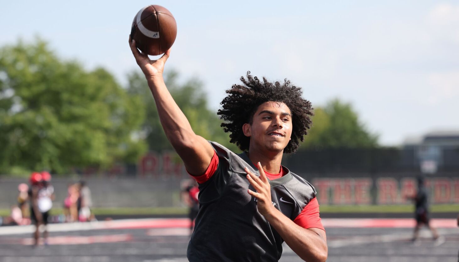 Bolingbrook quarterback Jonas Williams steps into the…