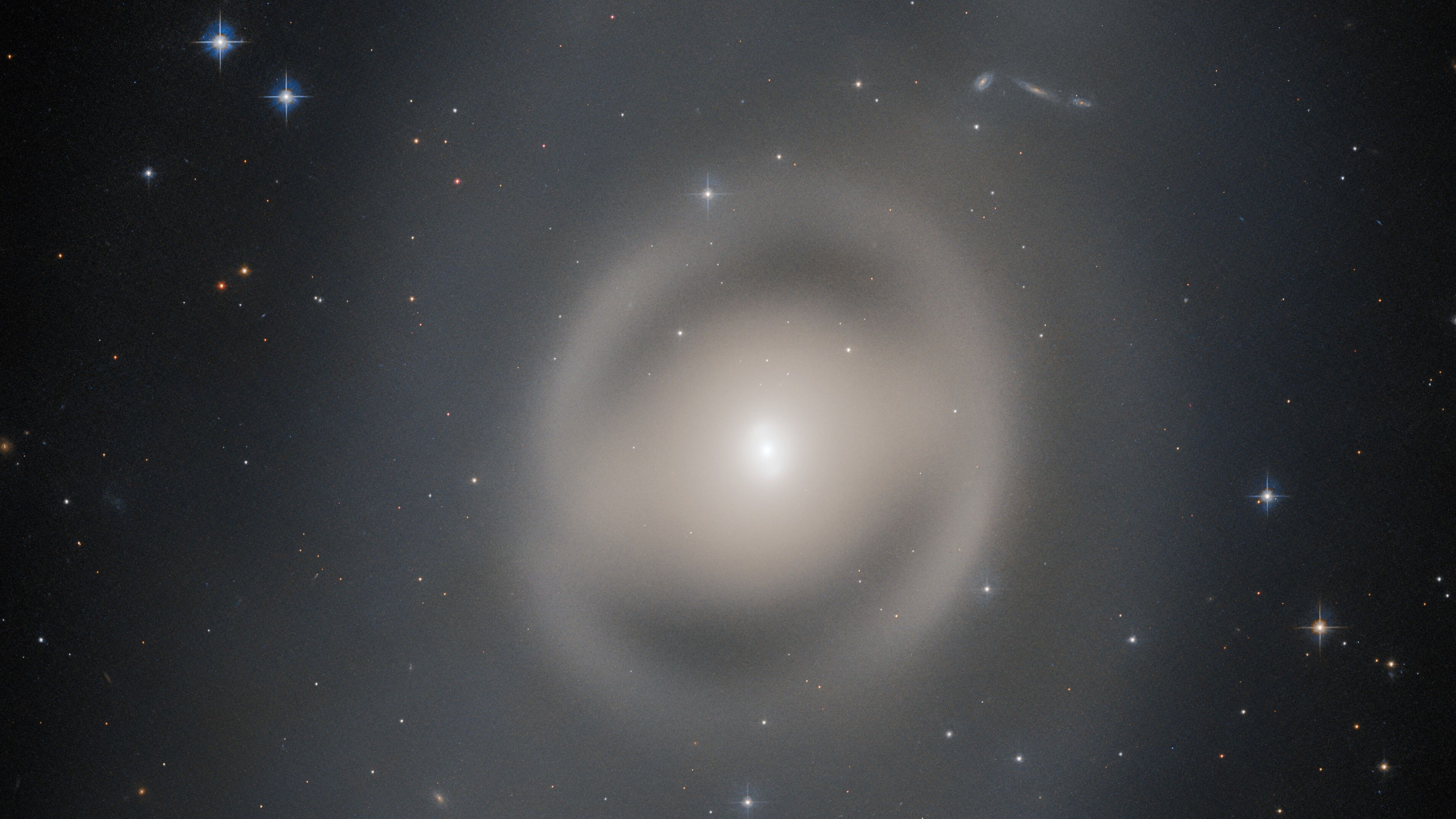 Hubble telescope captures a 'ghostly' galaxy glowing…