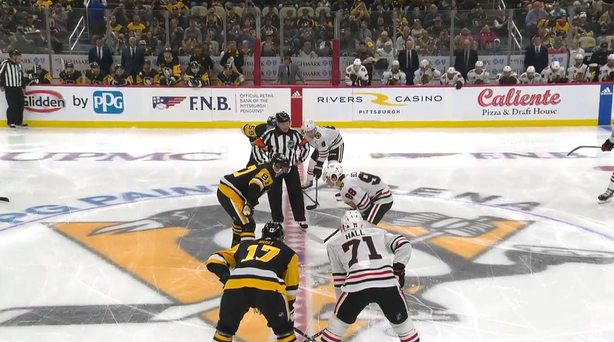 A ref welcoming Connor Bedard to the NHL before his…