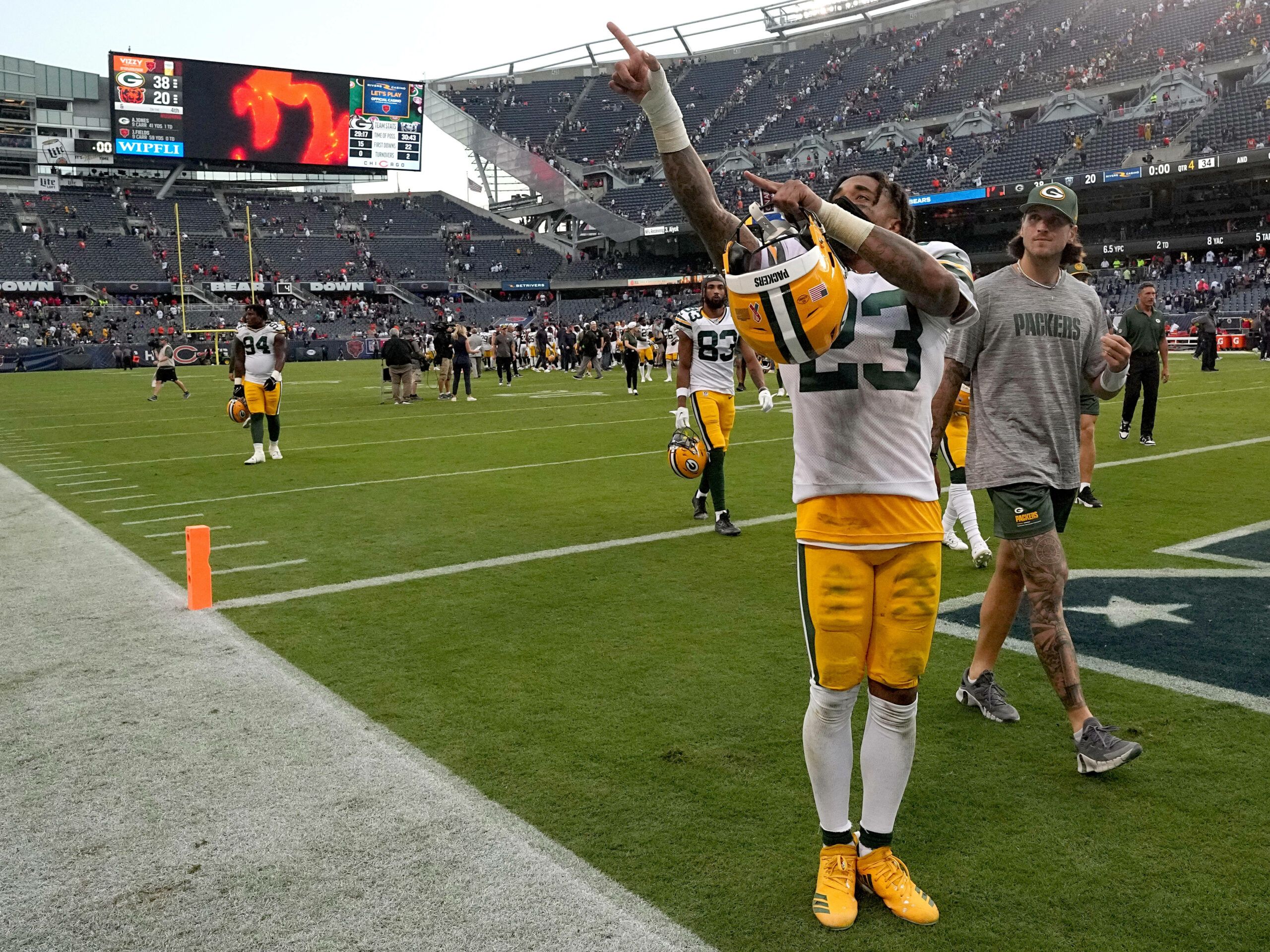 Packers CB Jaire Alexander (back) returns to the…