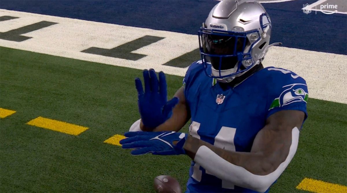 Sports Illustrated - DK Metcalf Hit a Sign Language TD…