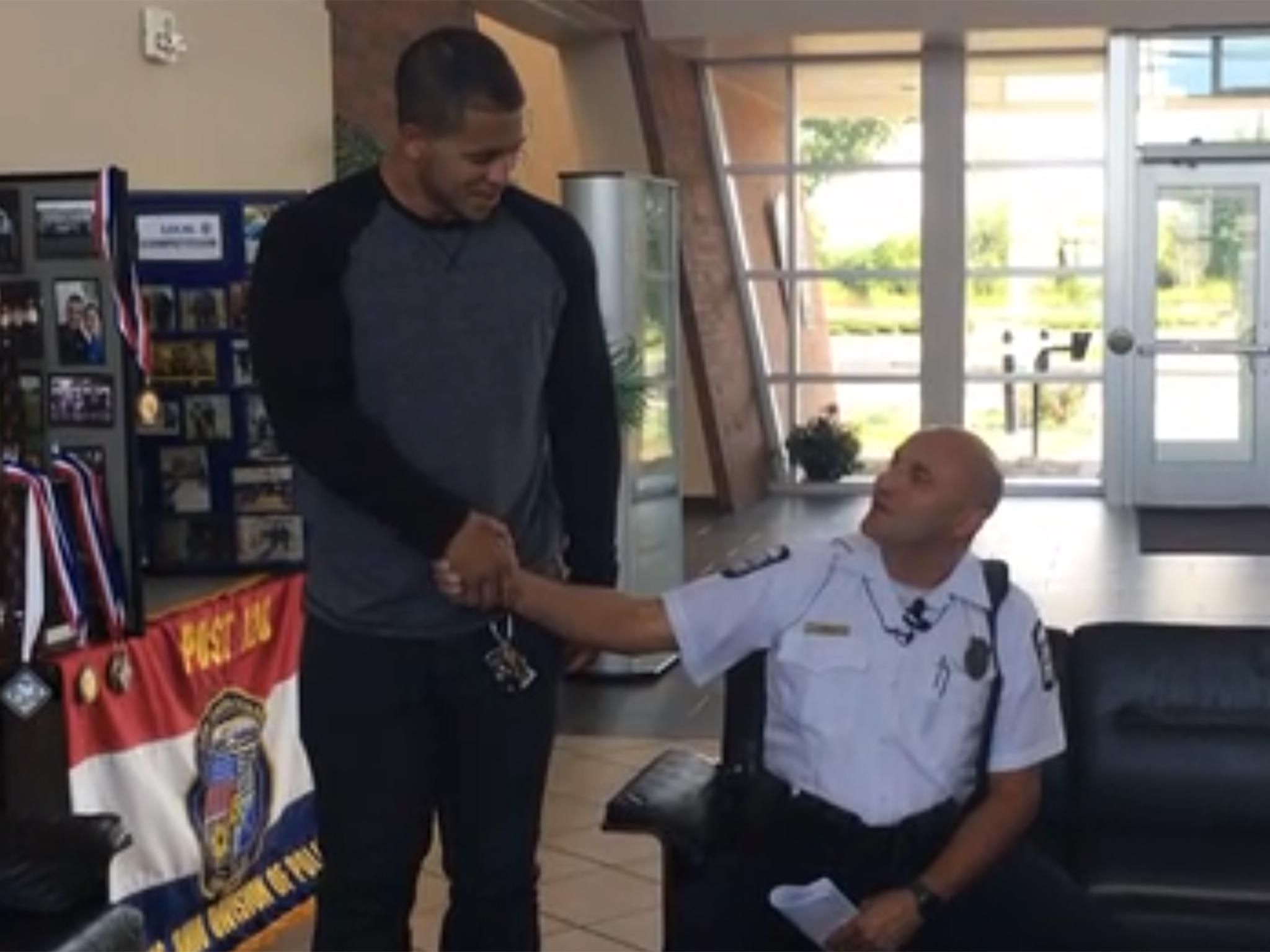 Man reunites with police officer who saved him from…