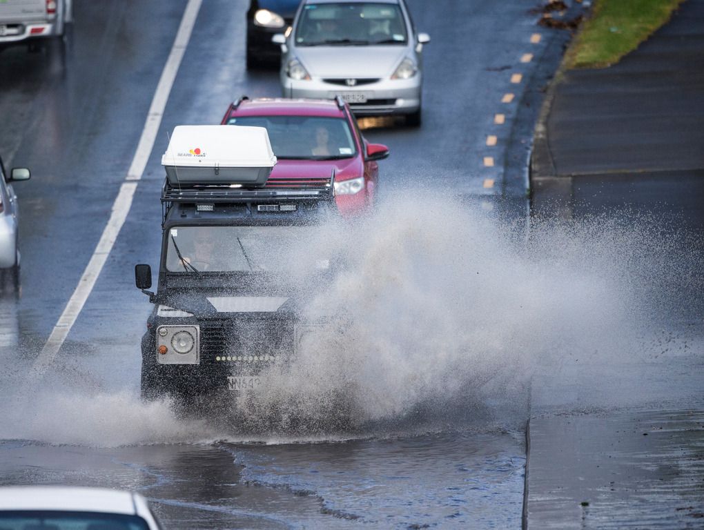 Wild weather topples trees, causes flooding and slips