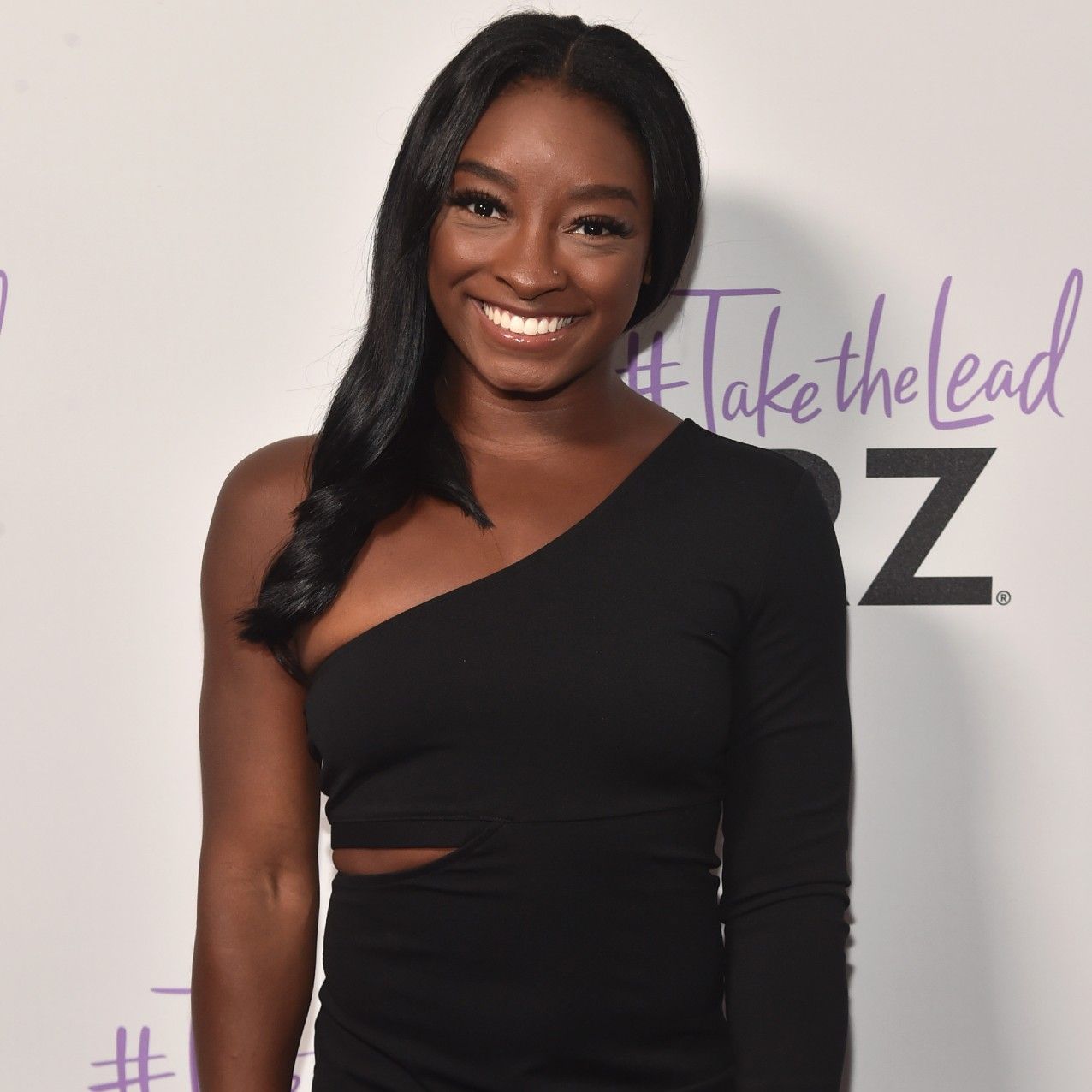 Simone Biles Vulnerably Opens Up About Entering Foster…