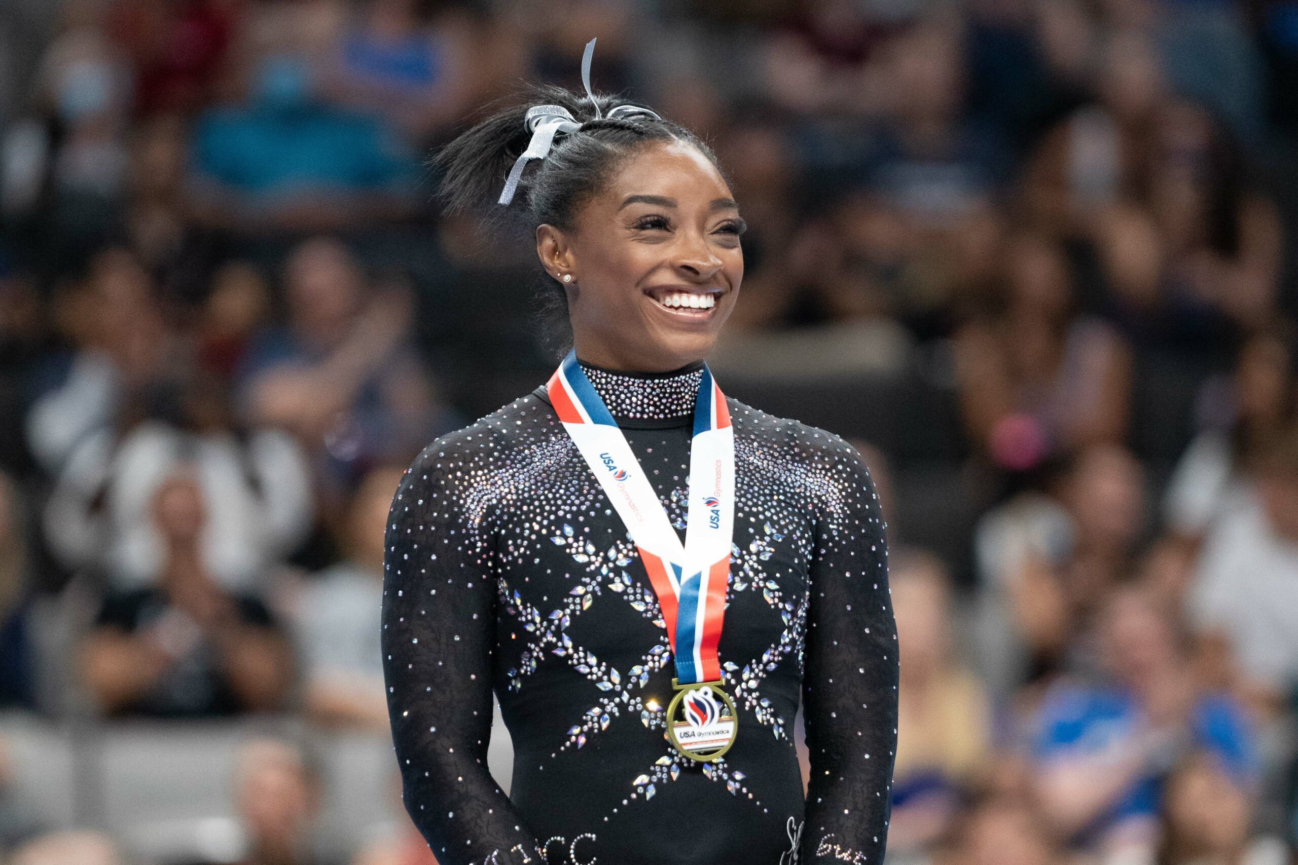 11 glorious photos of Simone Biles’ record-breaking…