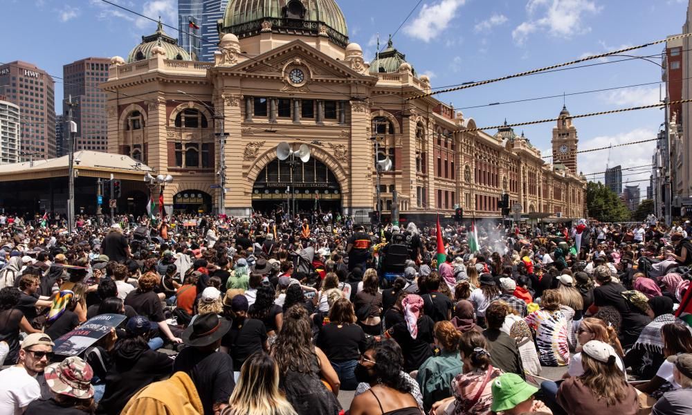 Thousands rally in solidarity on Invasion Day in…