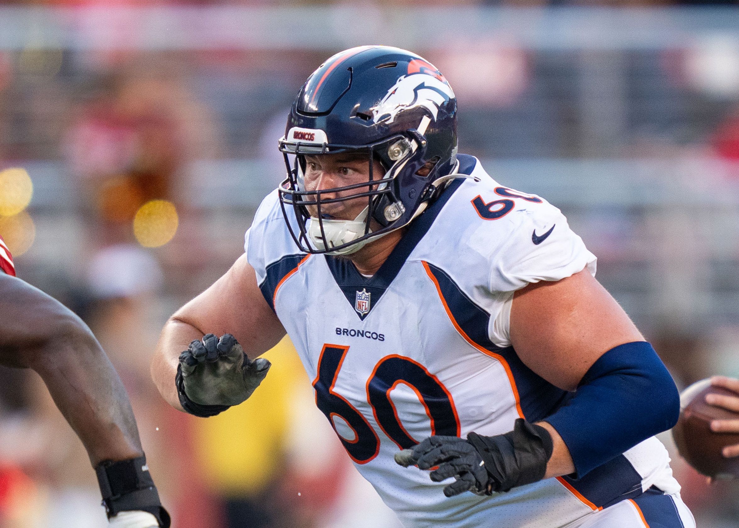 What is the Broncos’ plan at center after losing Lloyd…