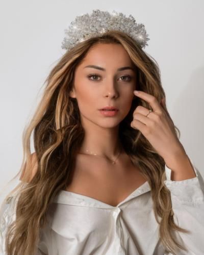 Elona Ndrecaj In White Outfit With Crown: A Regal Look