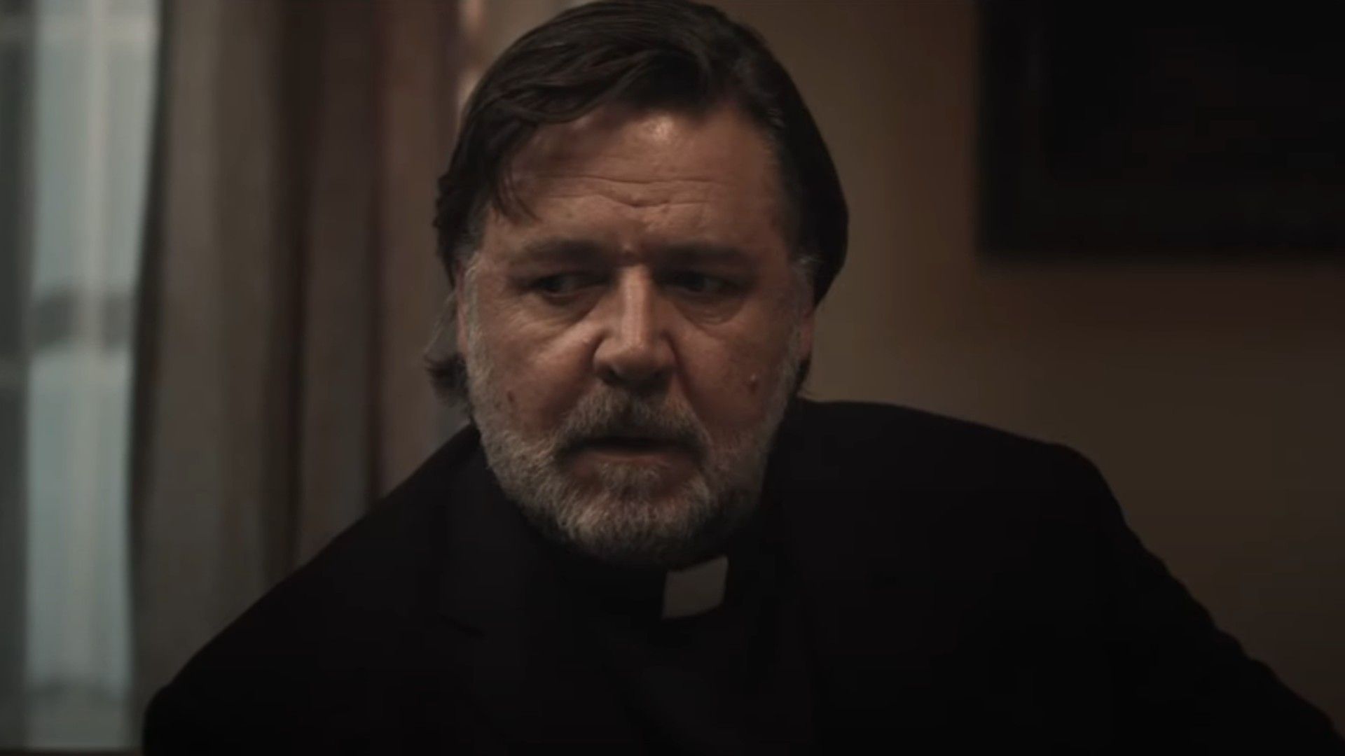 Russell Crowe is a pretend priest plagued by very real…