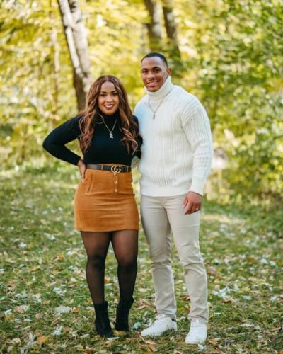 Elegant Harmony: Corey Ray And Wife In Matching White…