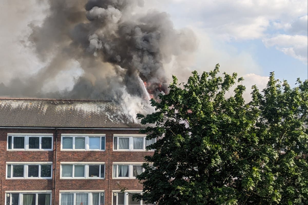 100 firefighters tackle blaze at block of flats in…