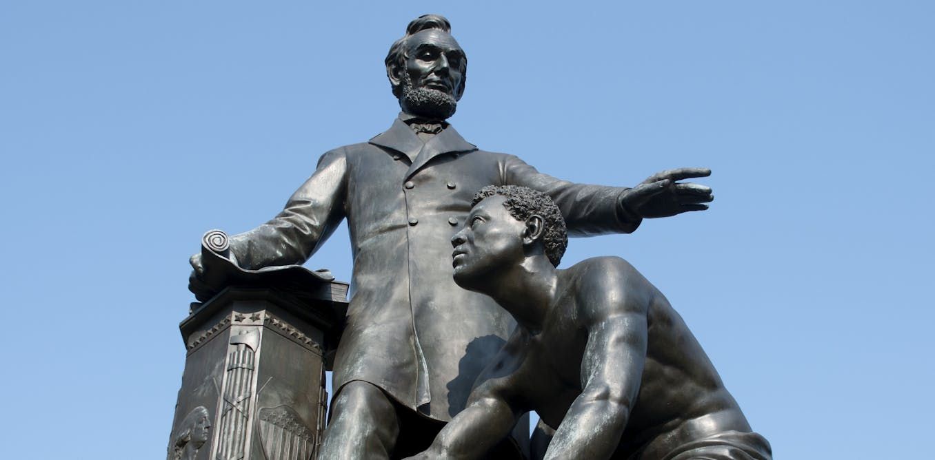 What the statue of a kneeling enslaved man in the…