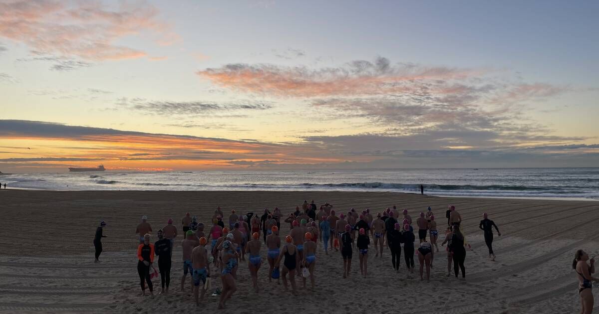 Sunrise ocean swimmers brave brisk waters on winter…