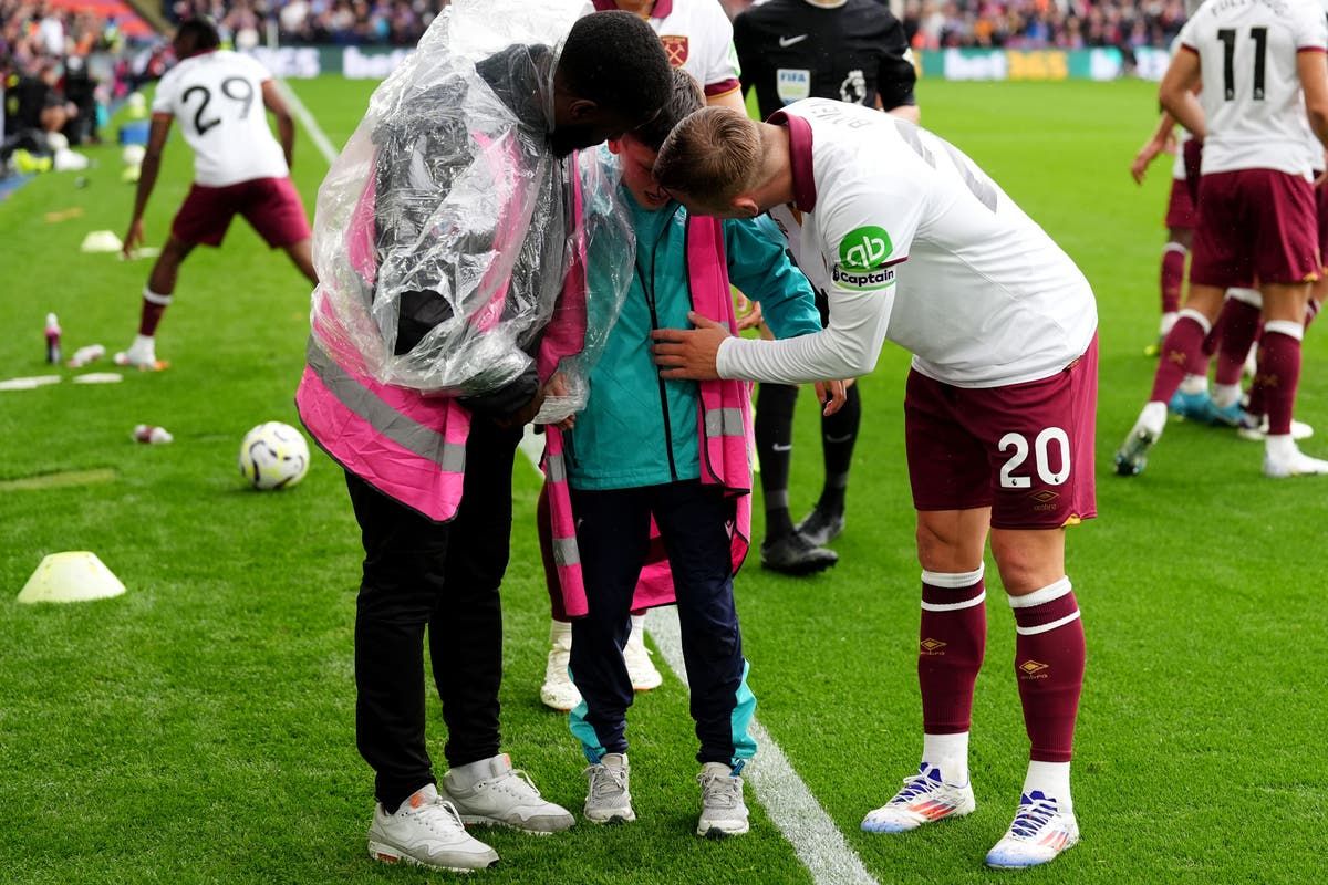 West Ham duo free ball boy from under collapsed…