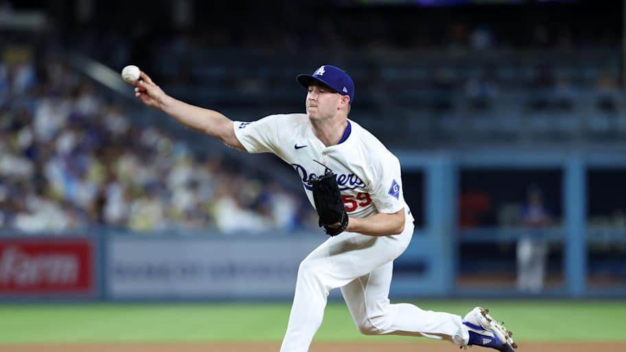 Sports Illustrated - Dodgers Keep Relief Pitcher Evan…