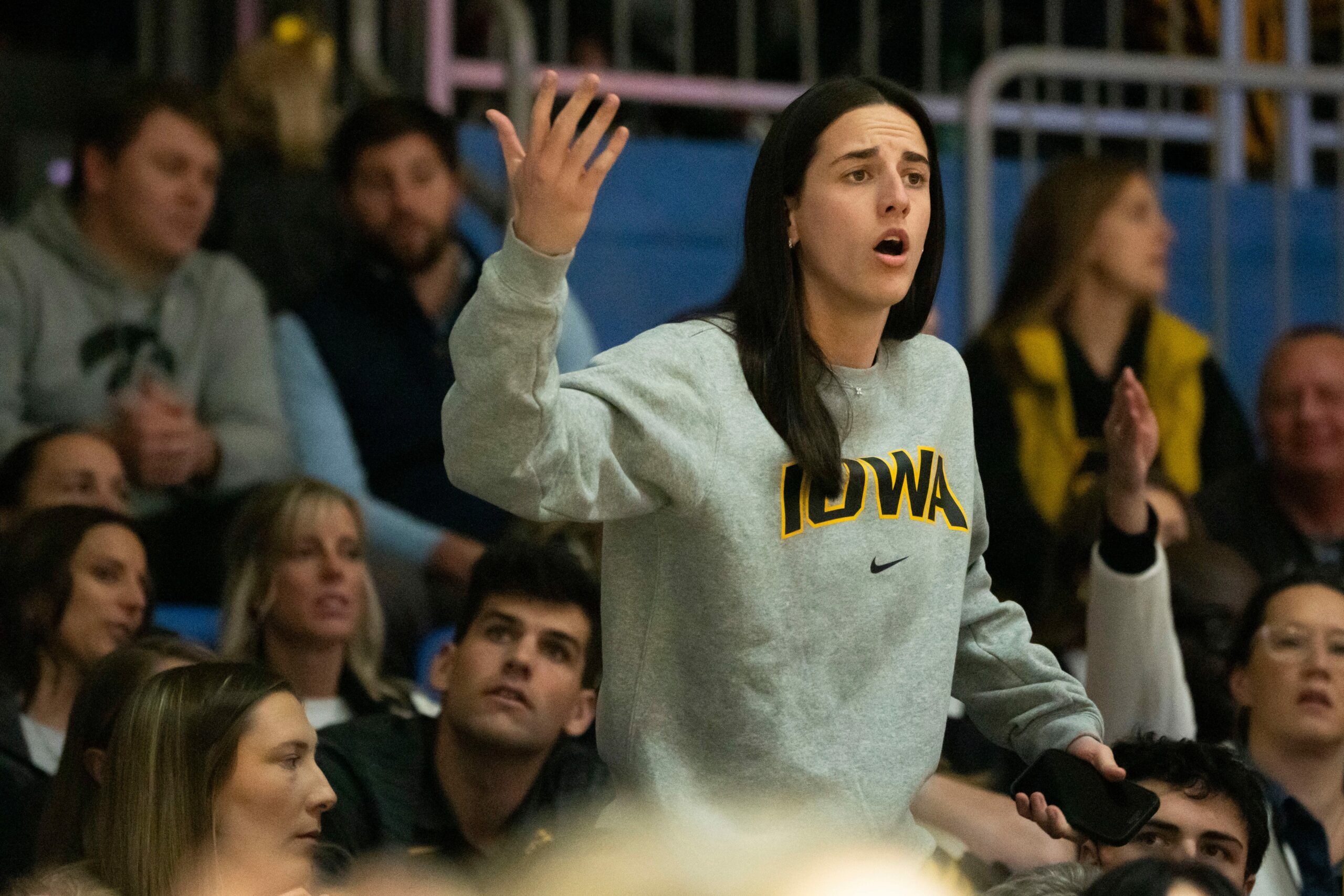 Caitlin Clark yelling at refs from the stands during…