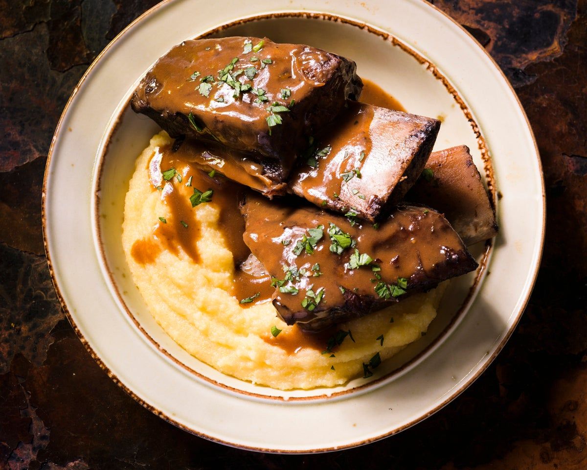Short ribs braised in wine and aromatics make for an…