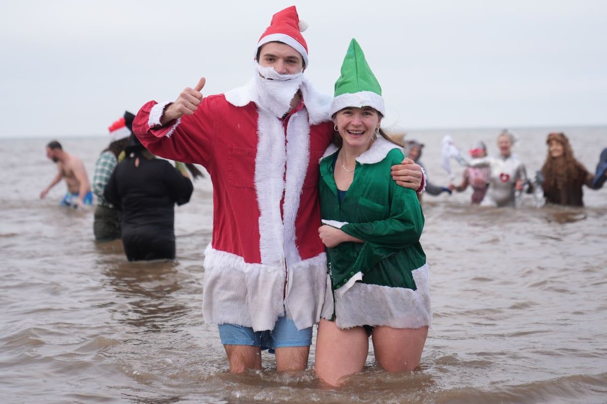 Christmas Day swimmers brave cool sea temperatures for…