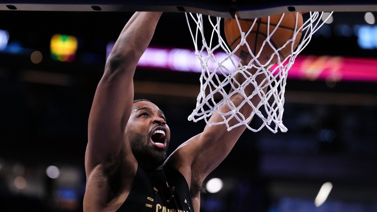 NBA star Tristan Thompson launches basketball…