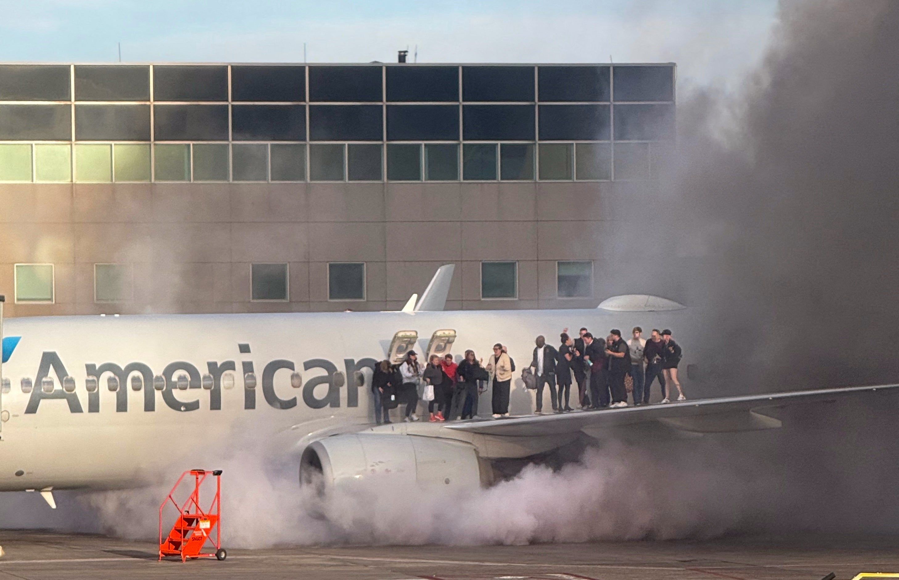 American Airlines plane catches fire on runway as…