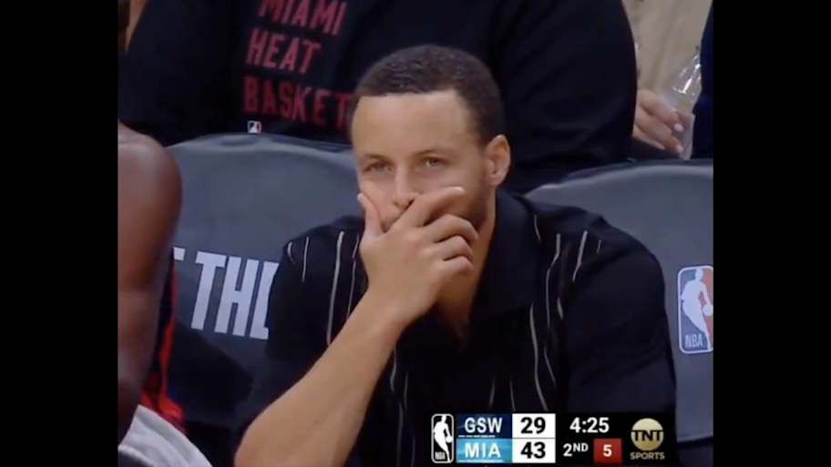 Sports Illustrated - Steph Curry Thinking on Bench…