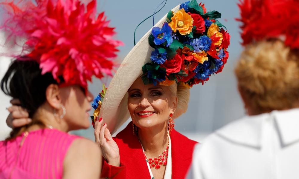 Aintree racegoers grateful for hats as sun shines for…