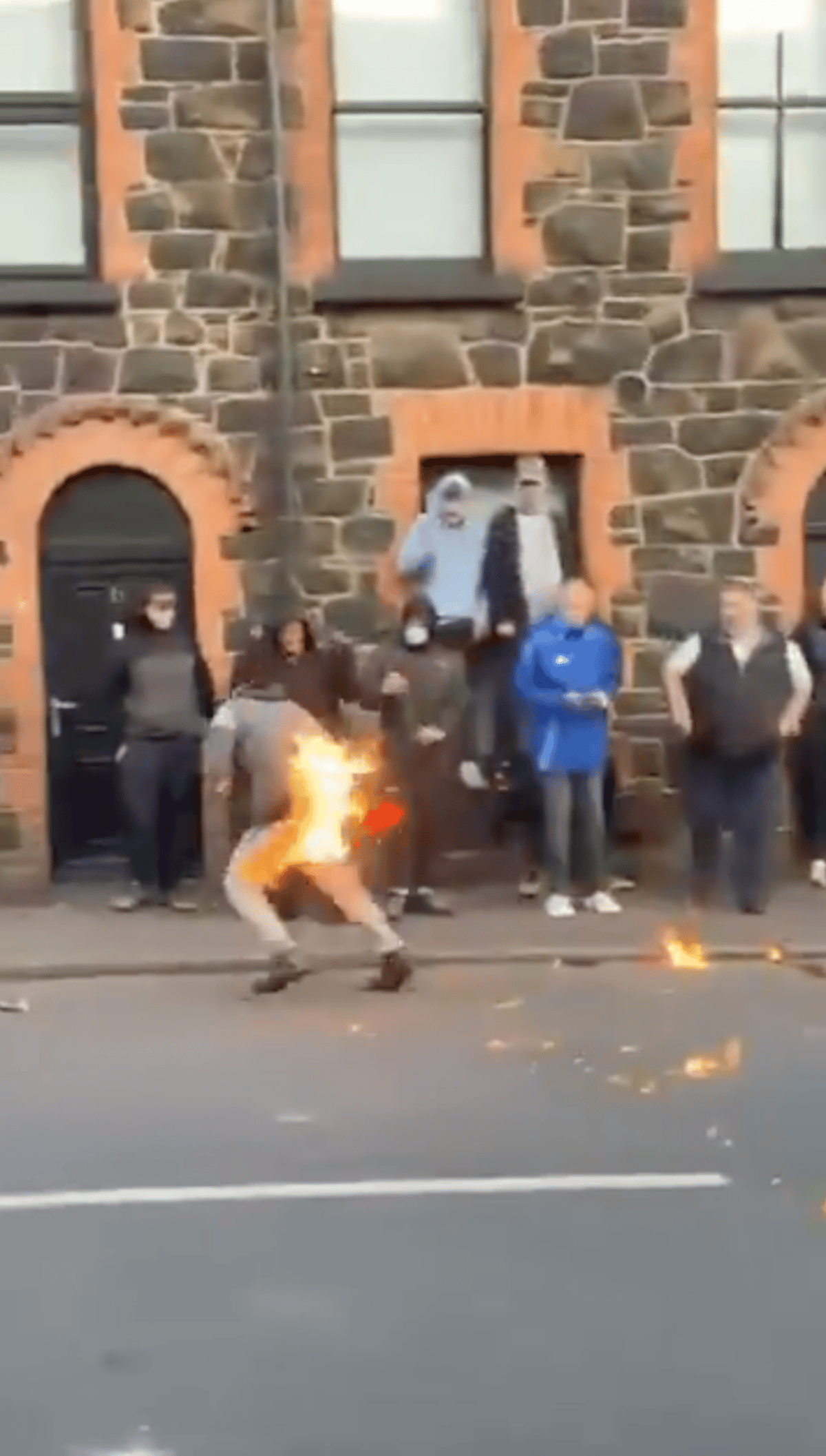Watch: Moment Ballymena rioter sets himself on fire as…