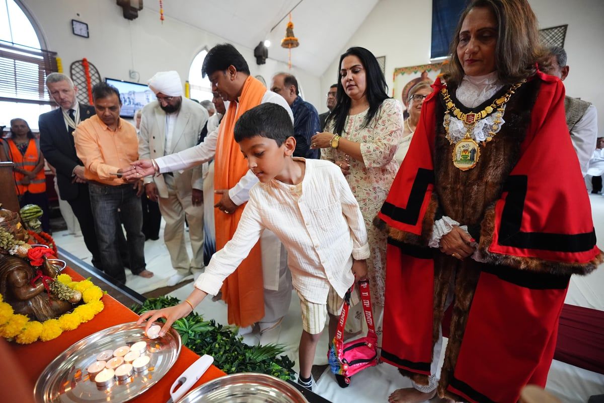 Dozens gather at Harrow temple to mourn family and…