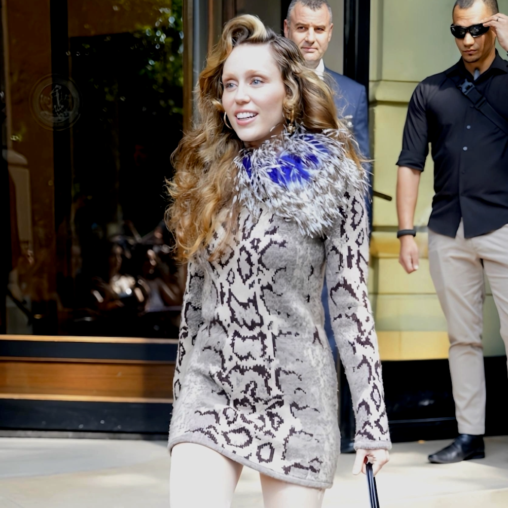 Miley Cyrus Slides Into a Feathered Snakeskin Mini…