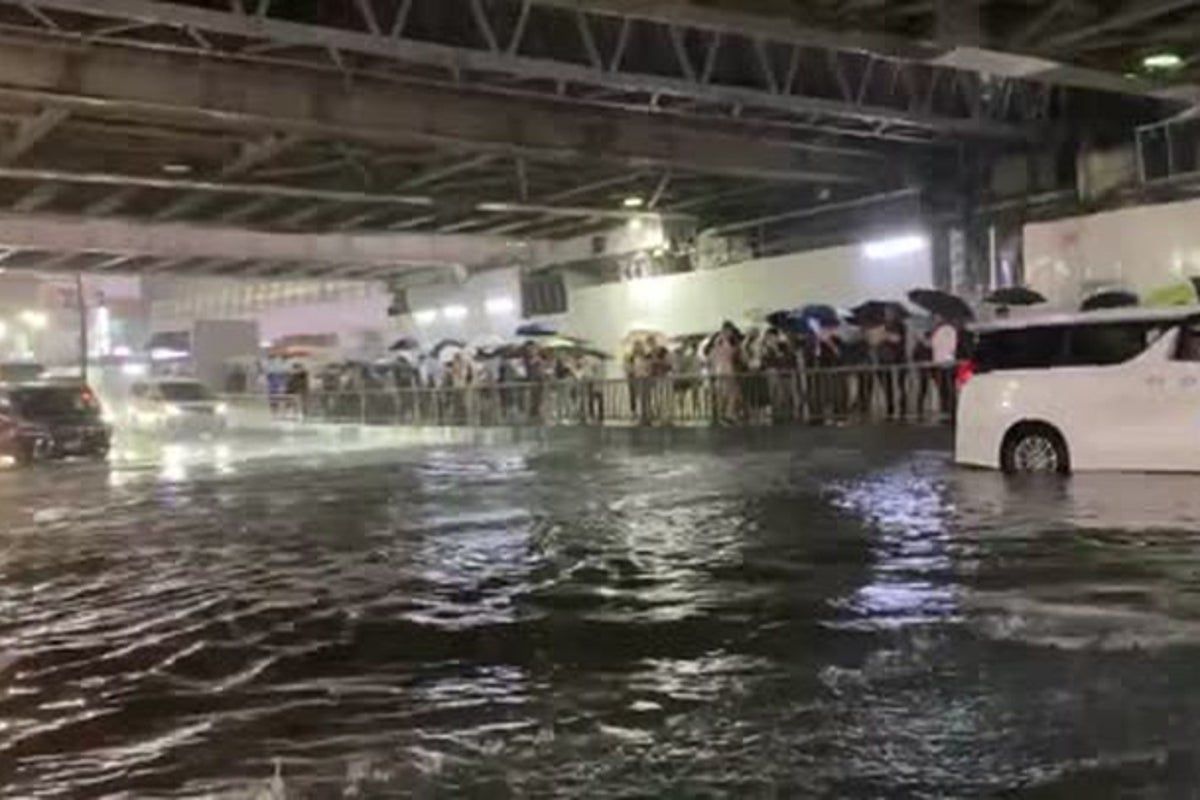 Tokyo road submerged in water as record rainfall…