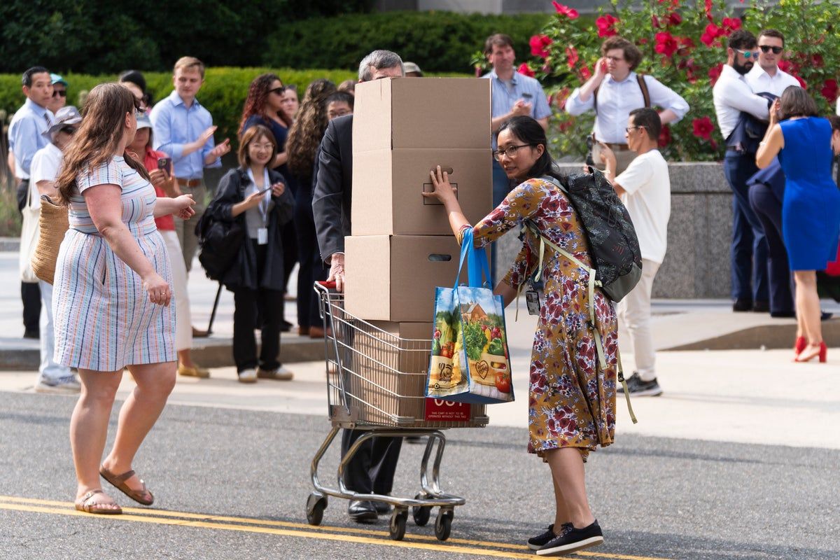 Photos of US State Department workers getting hugs and…