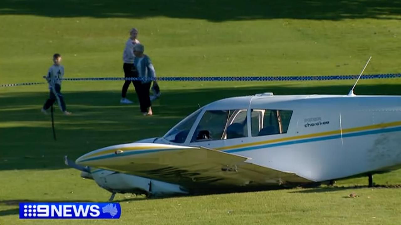 Light plane crash lands on suburban golf course