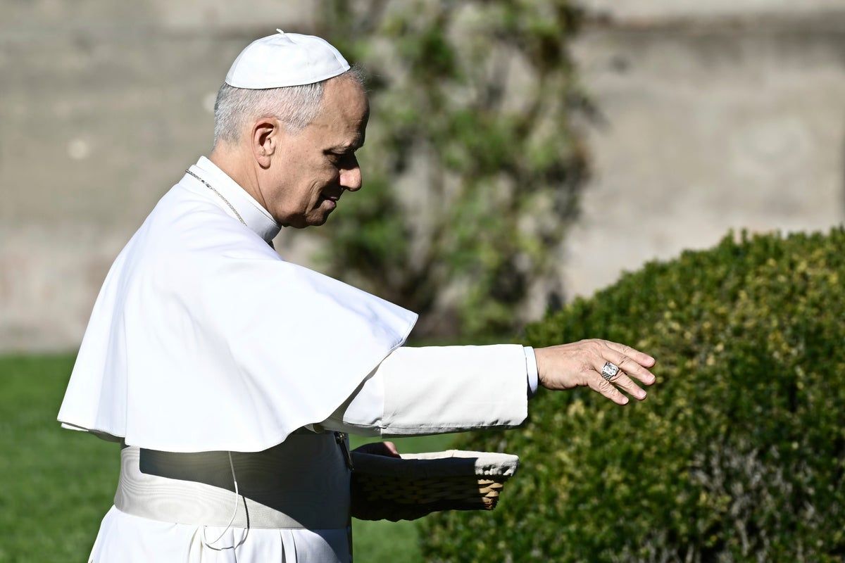 Pope feeds fish as he explores the Vatican’s new…