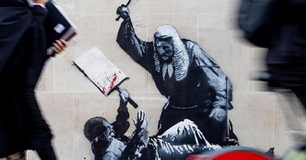 Banksy artwork covered up after 'making statement on…