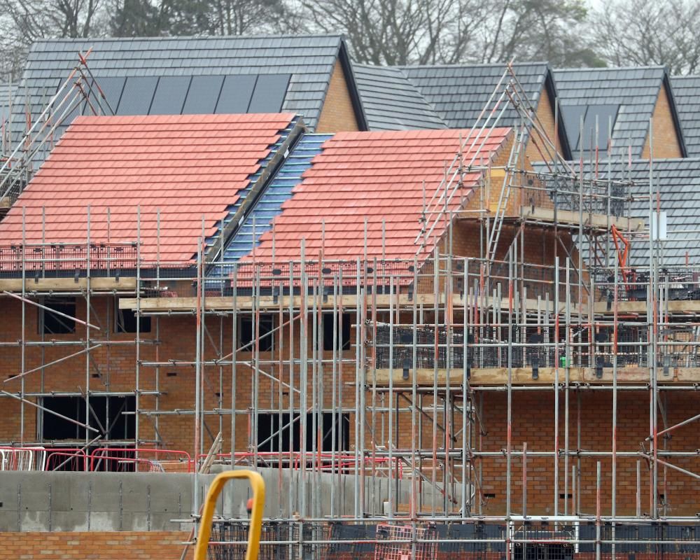 Housebuilder Vistry’s profits more than halve amid…