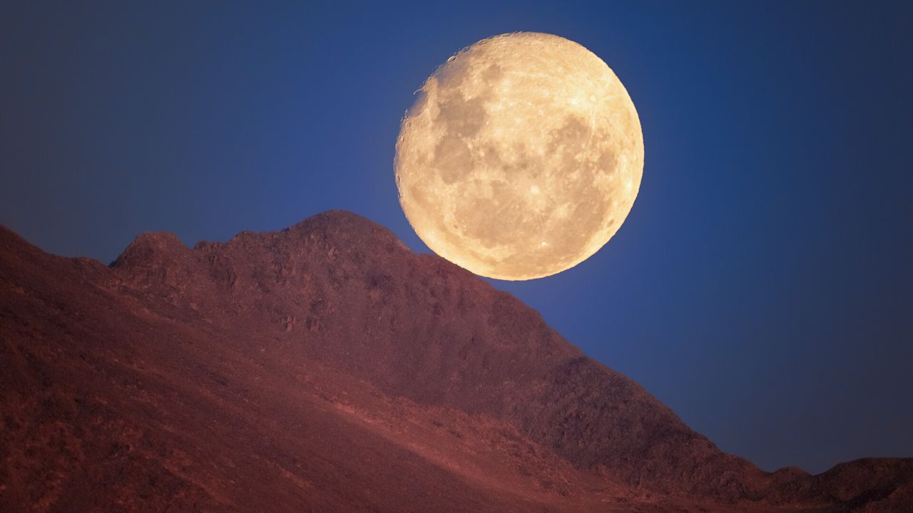 The moon looks set to roll down a ridge | Space photo…