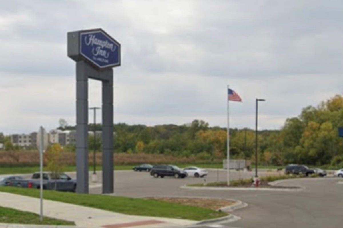Crane removes Hampton Inn Hilton sign at hotel accused…