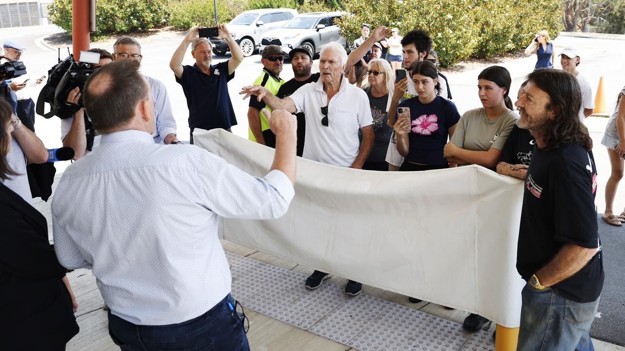 Premier evades angry mob amid backdrop of charred hills