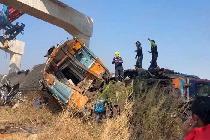 Moving train hits collapsed crane, 12 killed
