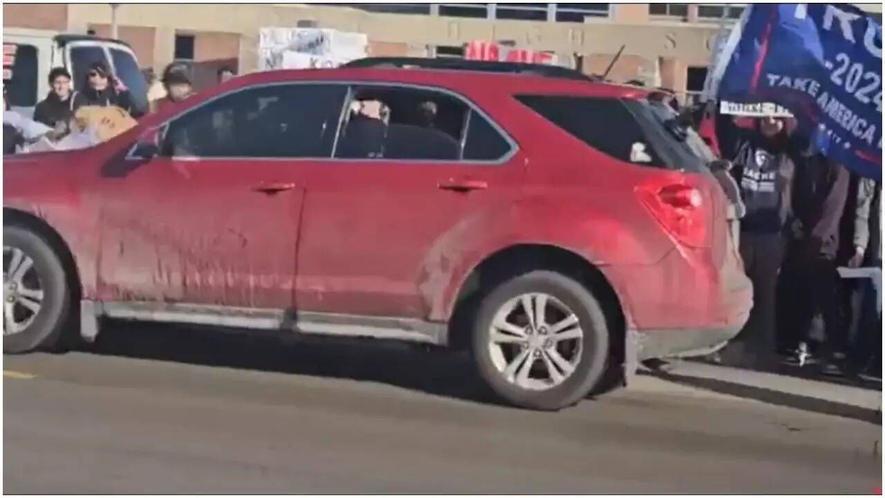 Watch: Red SUV with Trump flag hits student at…