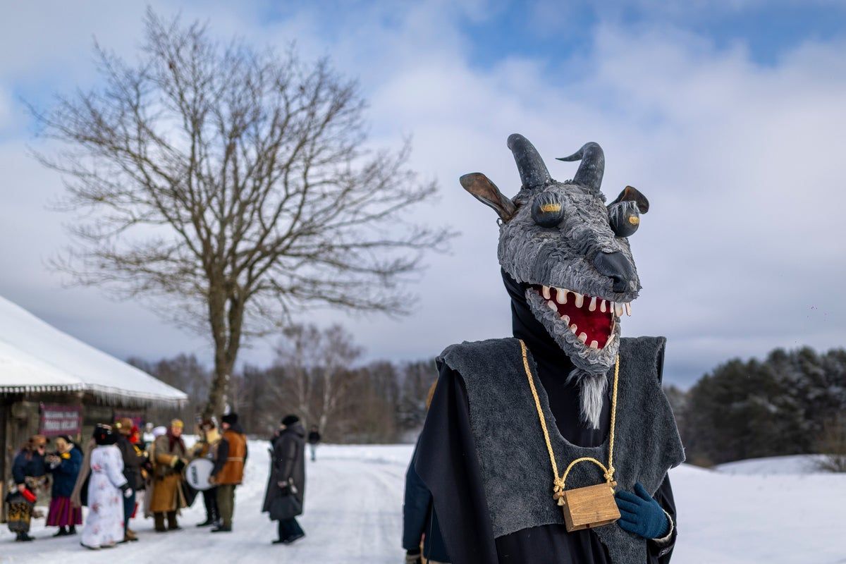 Photos show masked revelers celebrating Shrovetide in…