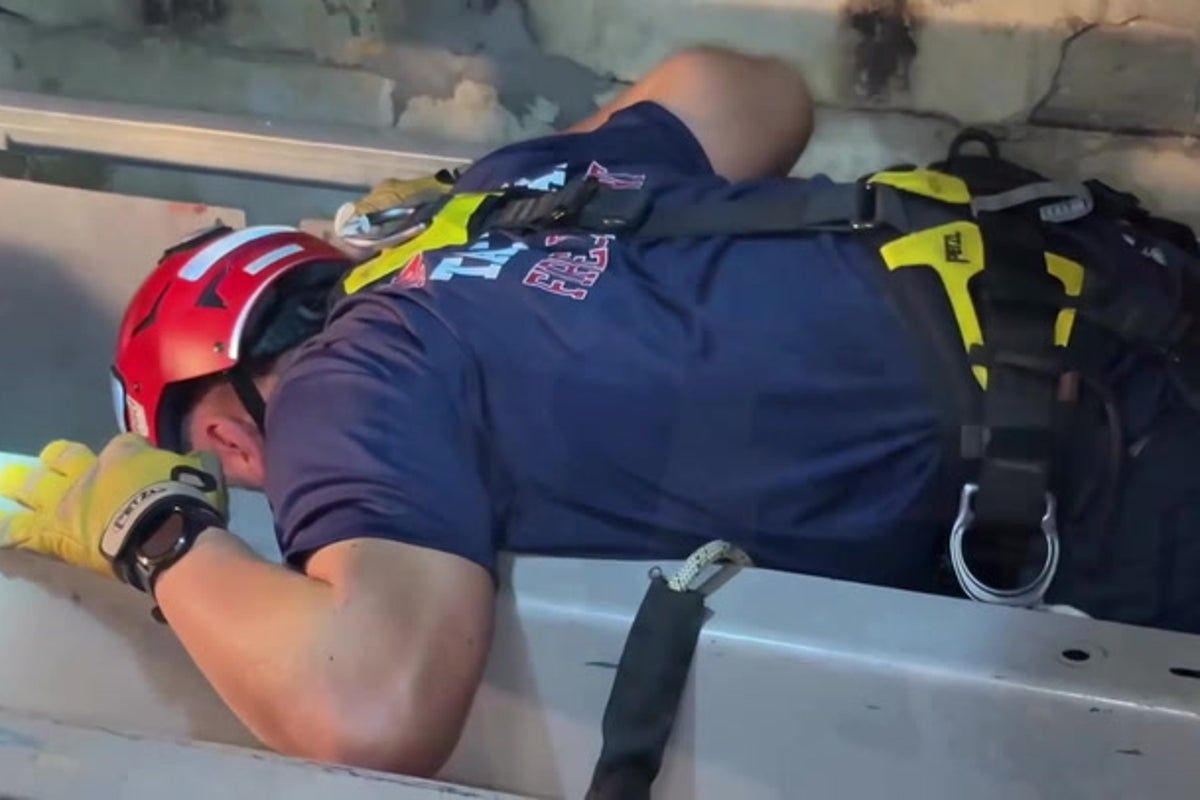 Pair trapped in elevator escape through roof as…
