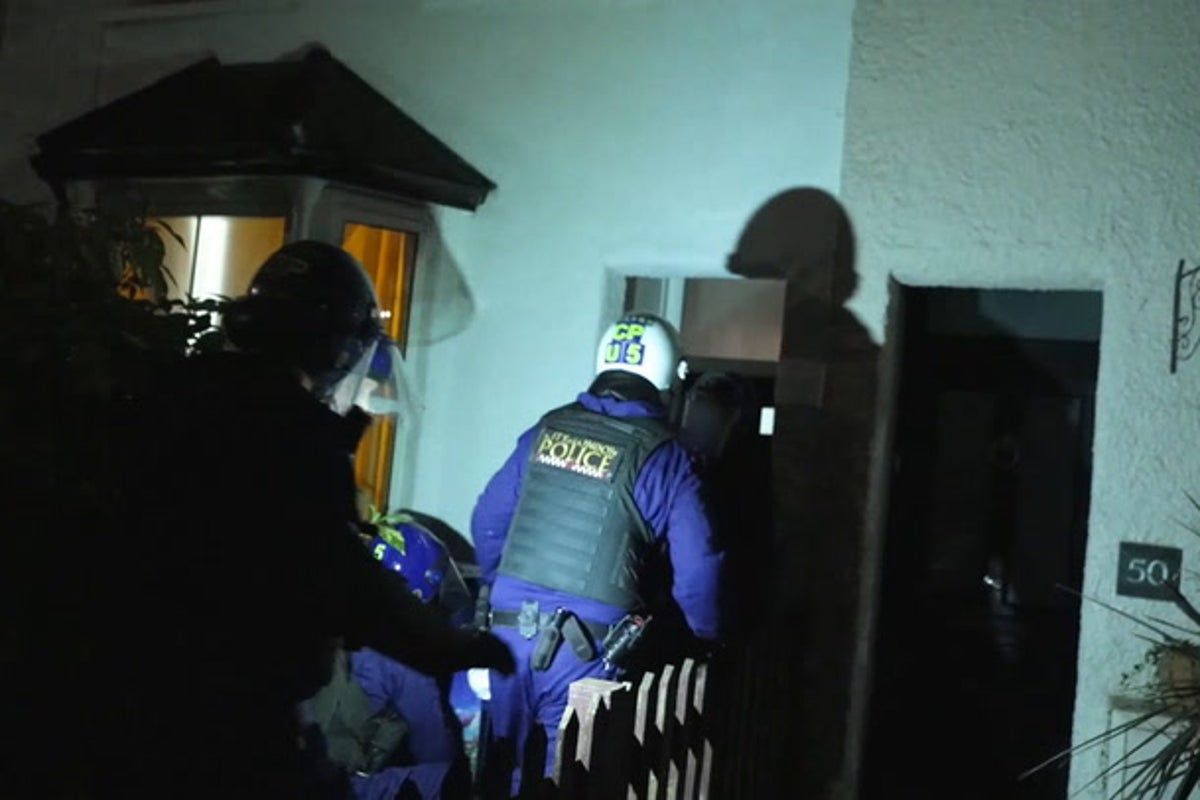 Police smash down door in dawn raid on £300,000 London…