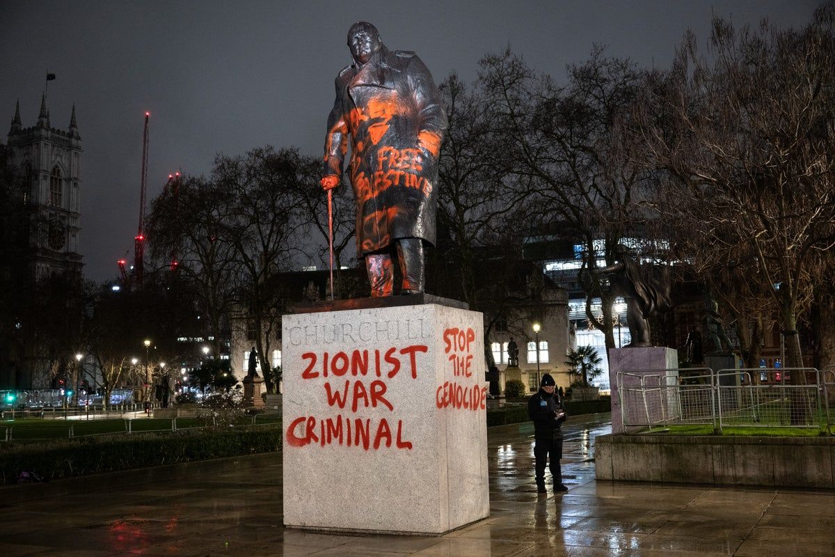 Man arrested after Churchill statue in London defaced…