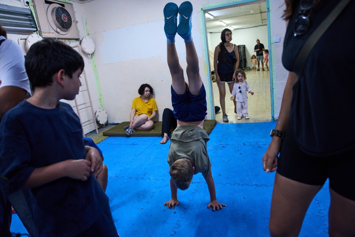 After morning of sirens, Israelis fall back into…